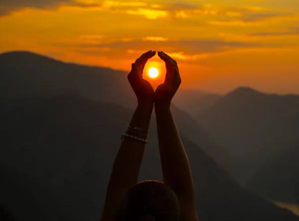 Female hands holding sun on sunny summer day Stock Photo by ...