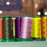 Textile machine with rainbow colors threads — Stock Photo © tdhster ...