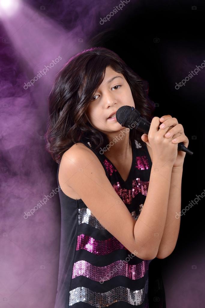 Child singing on stage — Stock Photo © mcgphoto #20239877