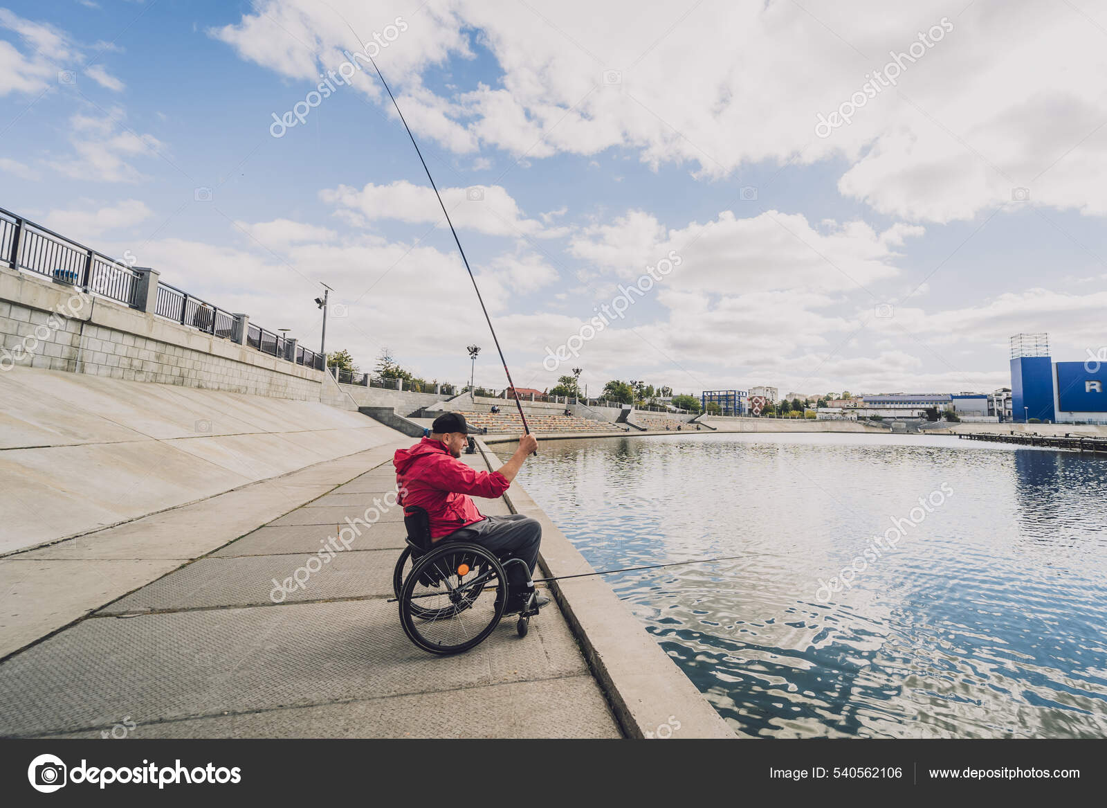 Person with a physical disability who uses wheelchair fishing from ...