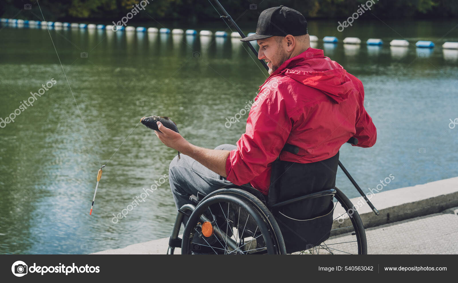 Person with a physical disability who uses wheelchair fishing from ...