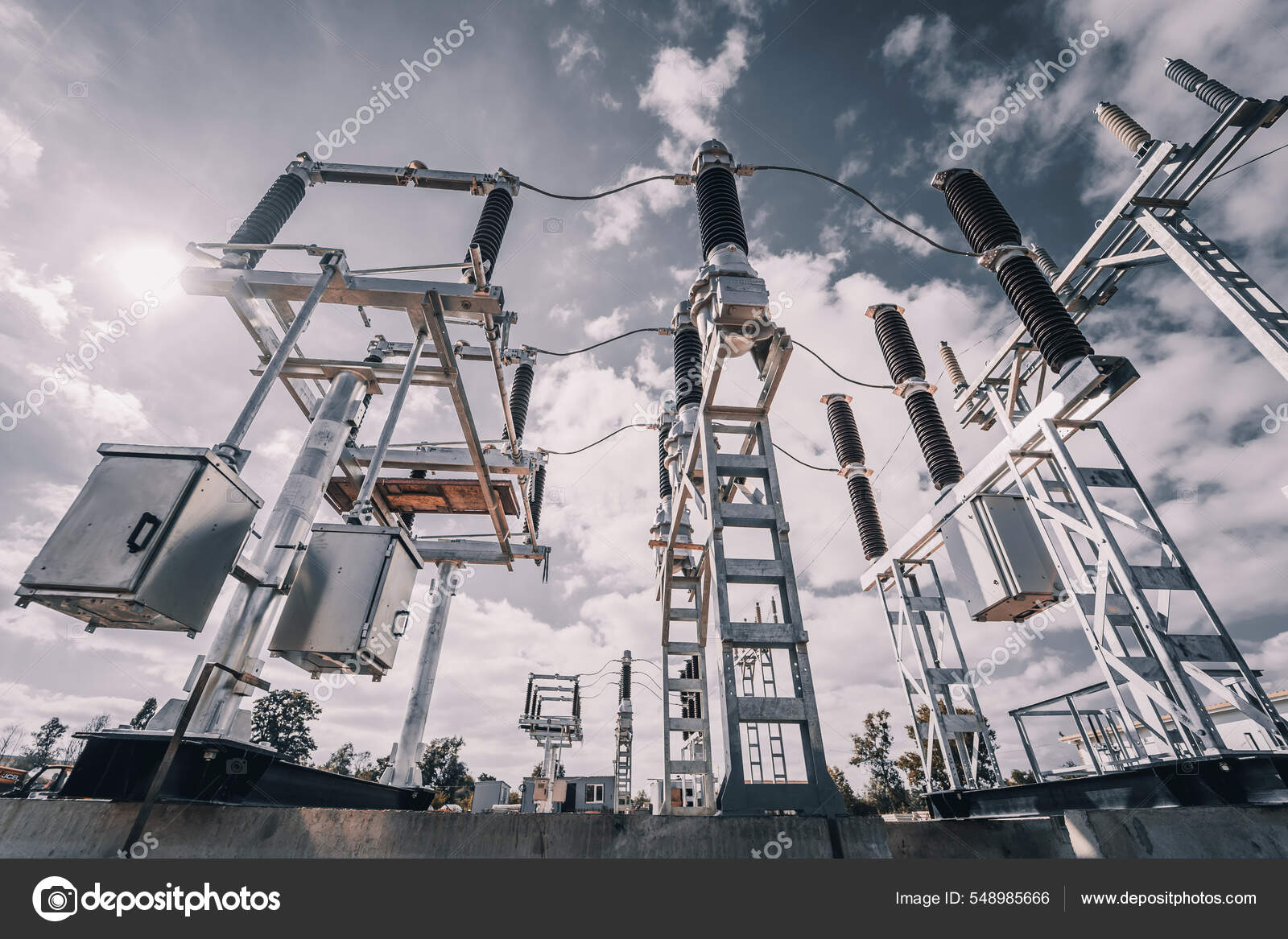 Construction of a power transmission substation on a background of grey ...