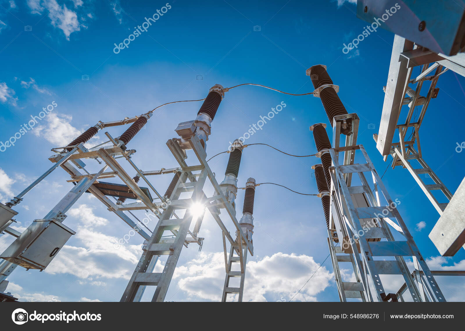 Construction of a power transmission substation on a background of blue ...