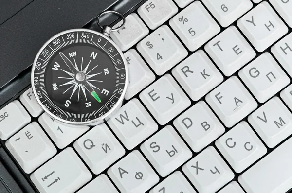 Computer keyboard and retro compass — Stock Photo © merznatalia #18372375