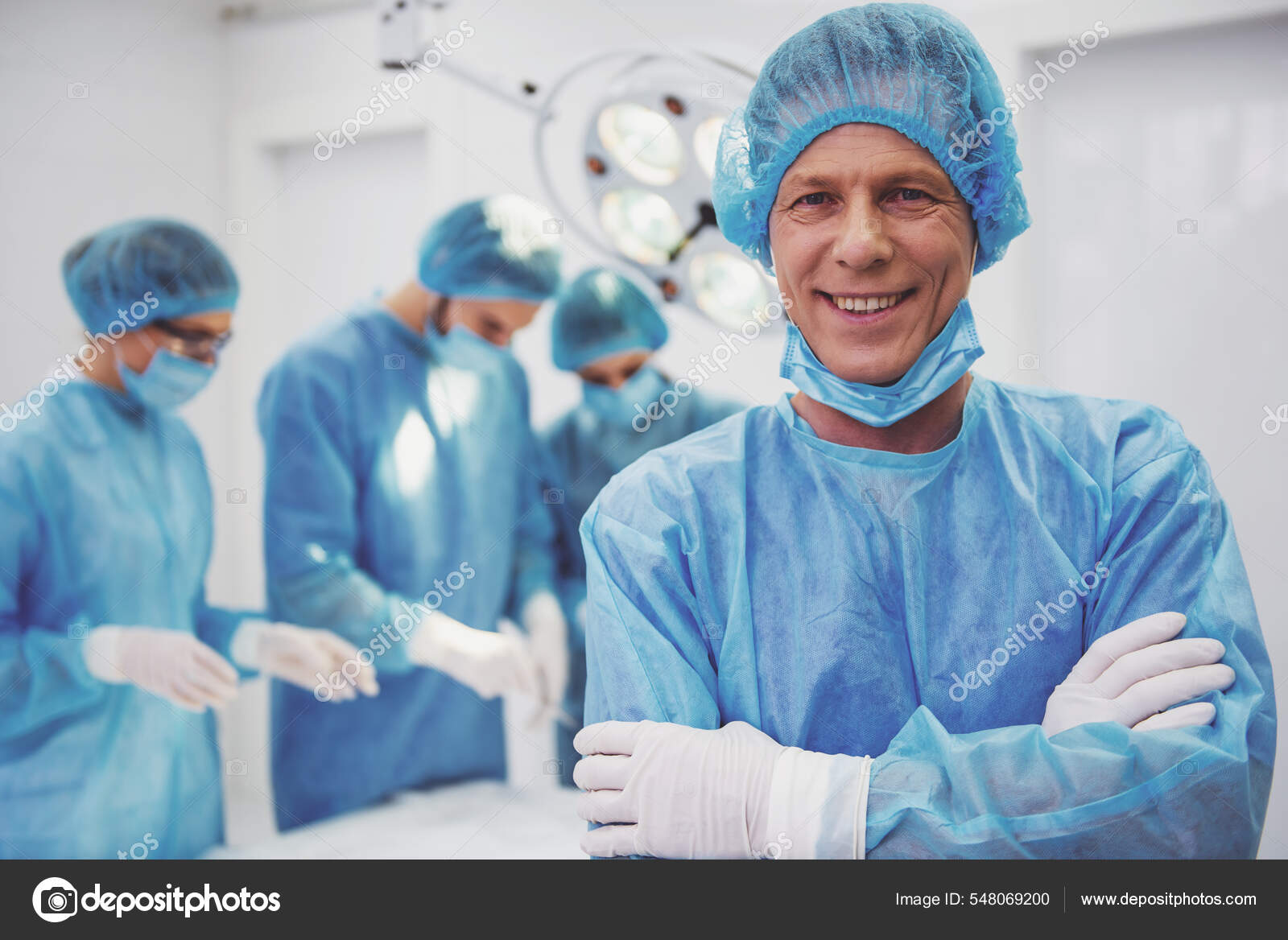 Team Surgeons Performing Operation Handsome Middle Aged Doctor Looking ...