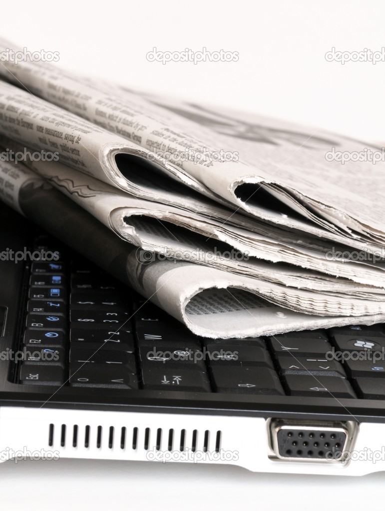 Newspapers on the notebook — Stock Photo © Viviamo #13972336