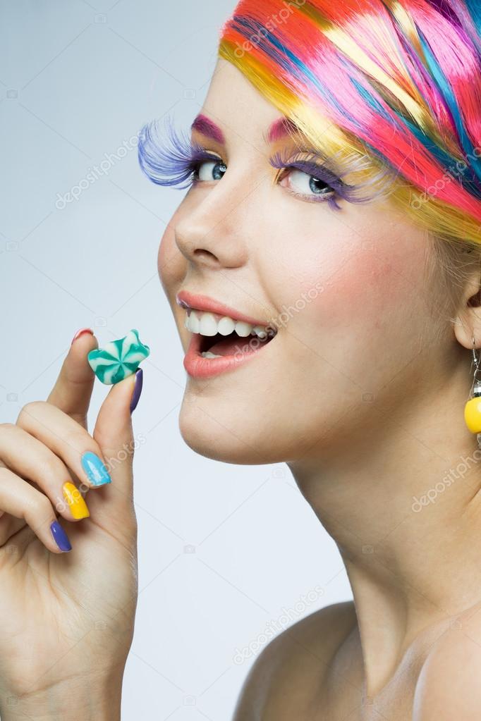 Girl eating candy Stock Photo by ©Genika 39599327