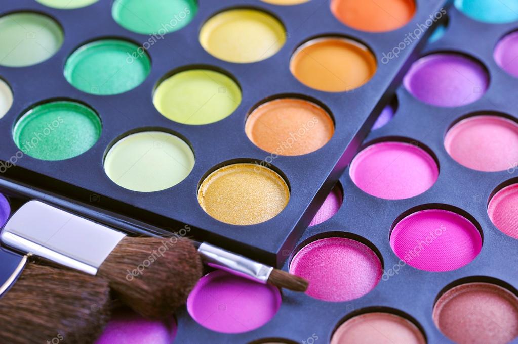 Professional eye shadows palette with makeup brushes. Makeup background ...