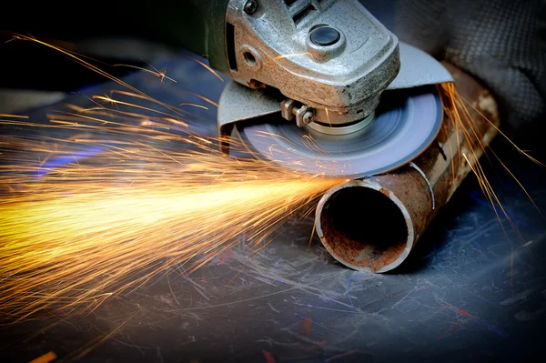 Worker cutting metal with grinder - Stock Image - Everypixel