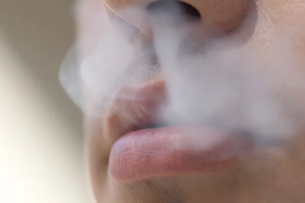 Cigarette smoke from the nose — Stock Photo © schankz #30834889