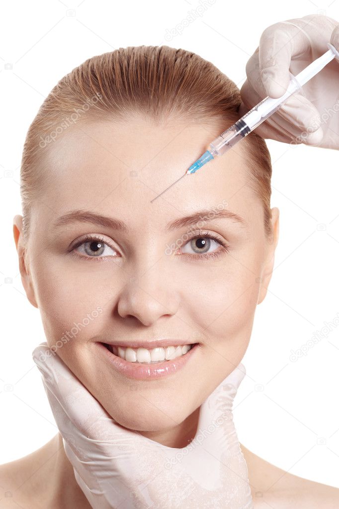 Beautiful woman gets an injection in her face isolated on white Stock ...