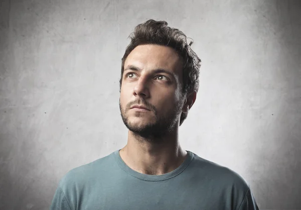 Young man in doubt — Stock Photo © kantver #58418619