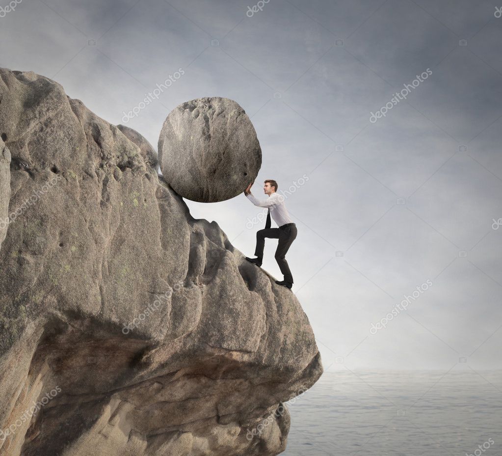 Businessman holding a rock — Stock Photo © olly18 #30254081