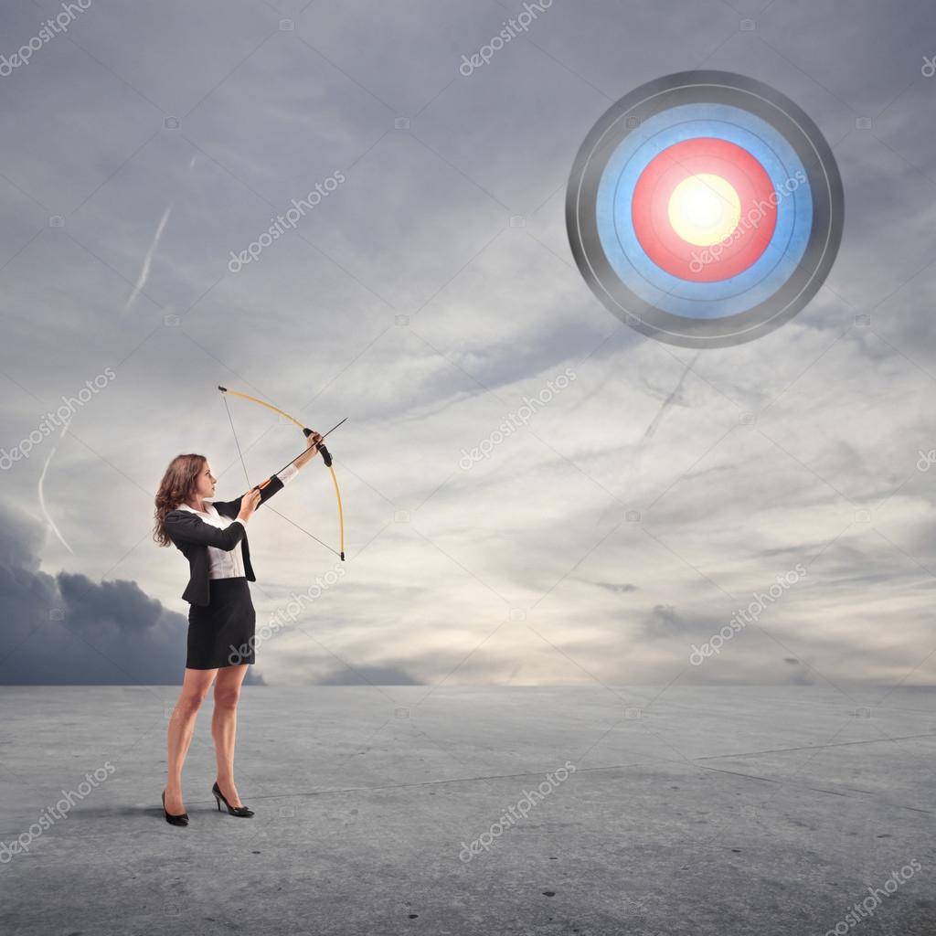 Business woman throwing an arrow Stock Photo by ©olly18 31297571