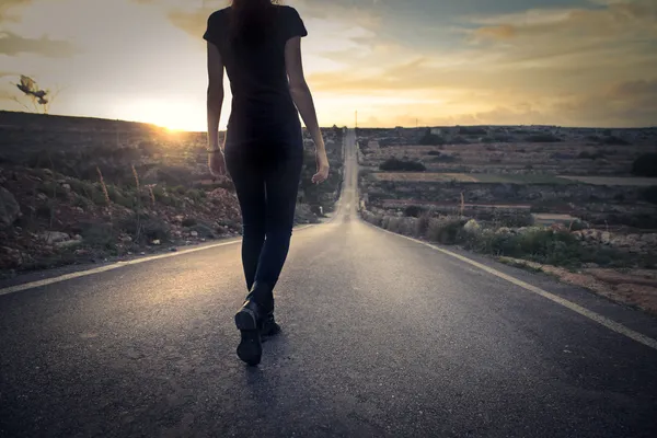 Woman walking down the street - Stock Image - Everypixel