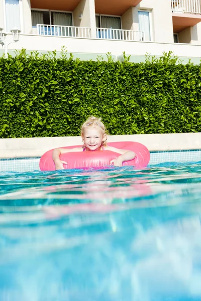 Little girl with rubber ring in swimming pool — Stock Photo © phb.cz ...