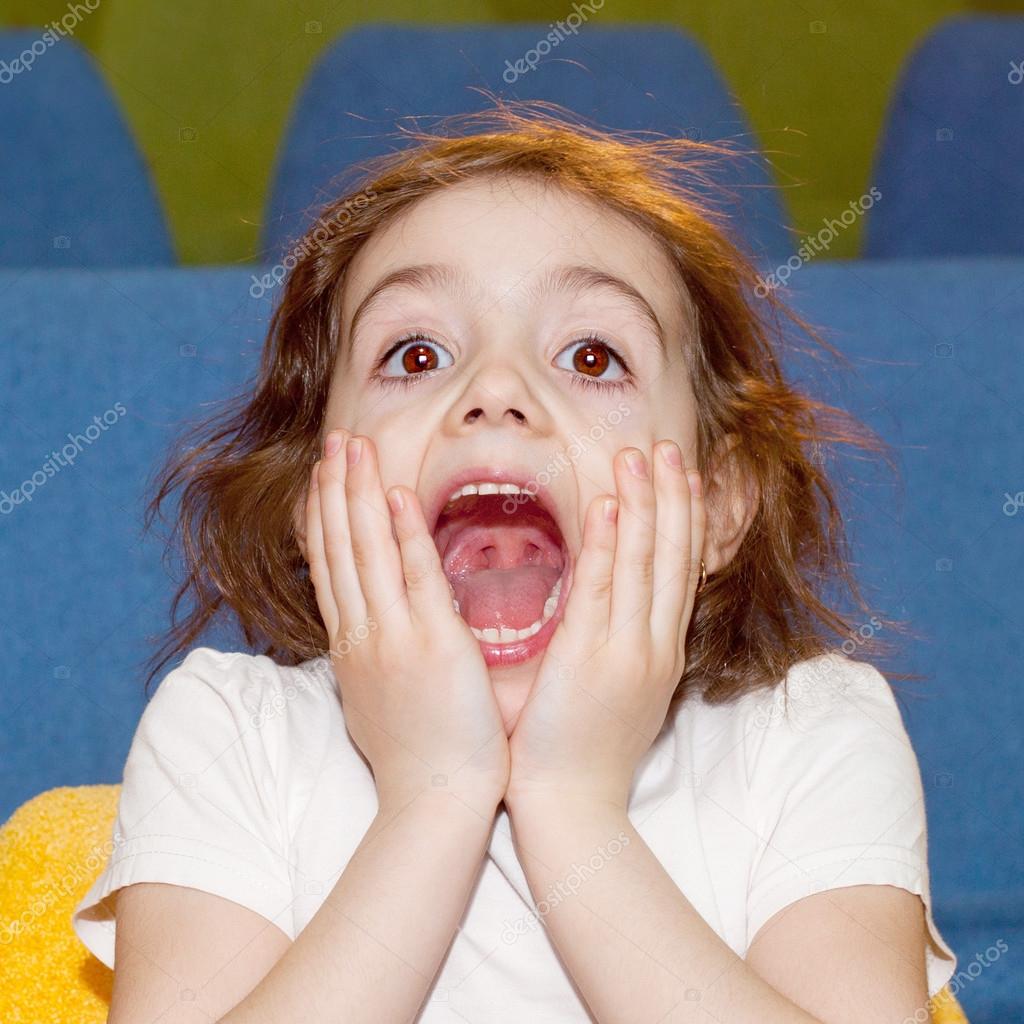 Girl scared in the cinema hall — Stock Photo © lanych #51500937