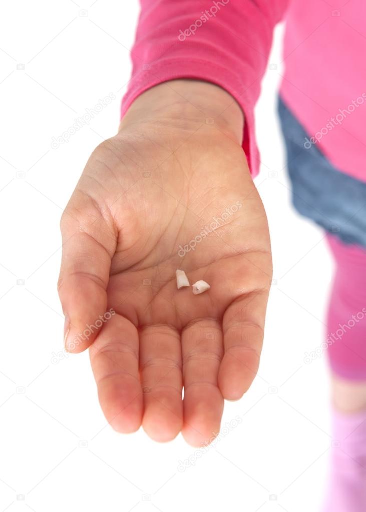 Hand with two milk teeth — Stock Photo © luna123 #23864707