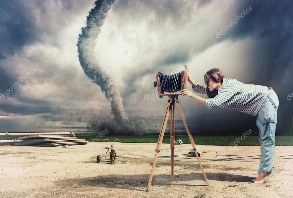 Photographer and tornado — Stock Photo © vicnt2815 #12579801