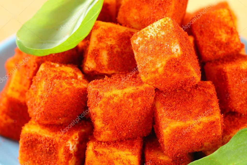 Diced cheese rolled in paprika Stock Photo by ©ajafoto 26364855