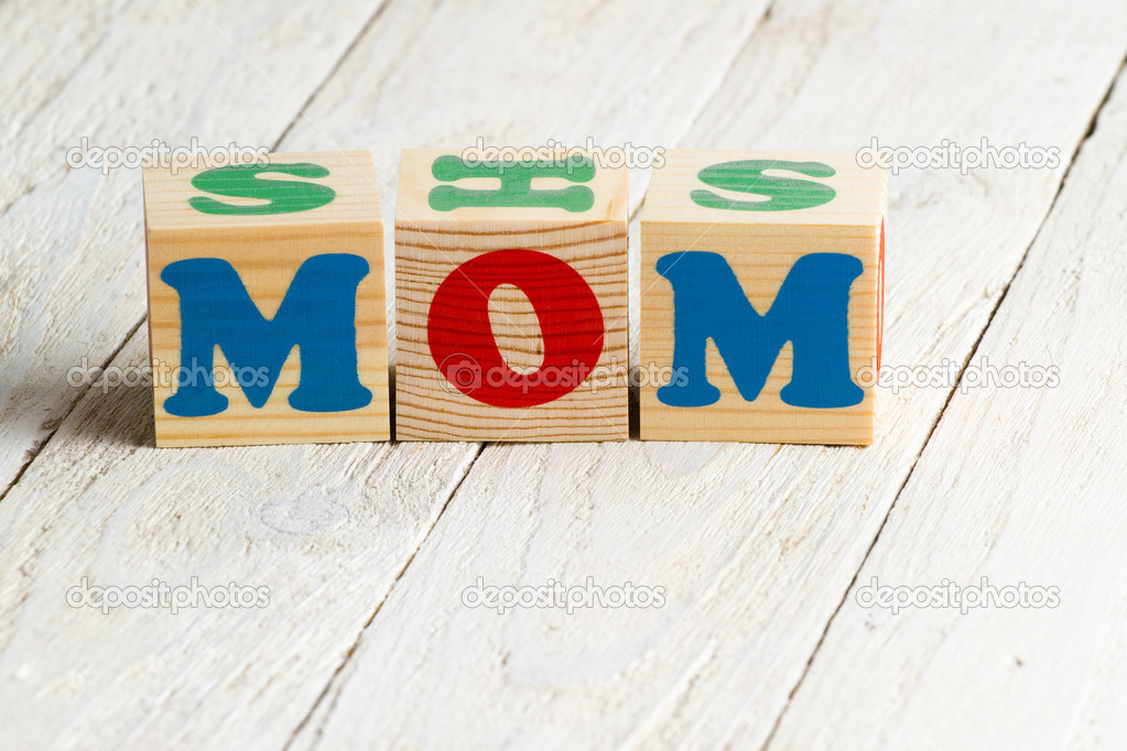Wooden blocks with MOM word Stock Photo by ©Dmitry.Zimin 48603011