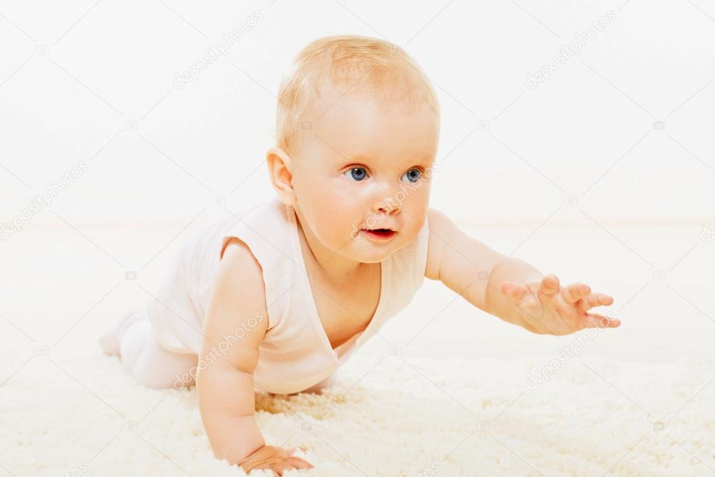 Cute baby creeping on carpet Stock Photo by ©furtaev 26417035