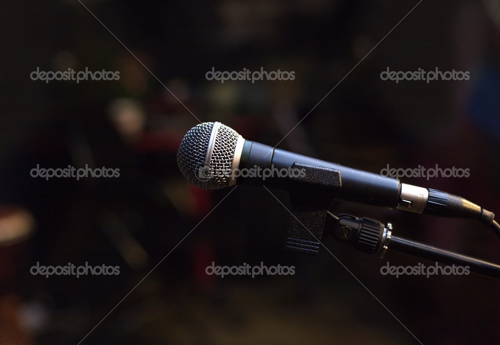 Microphone on stage close up Stock Photo by ©iDyMax 32655095