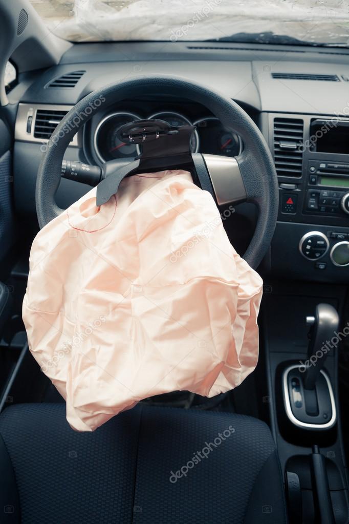 Airbag explodes on steering wheel — Stock Photo © nikkytok #14053360
