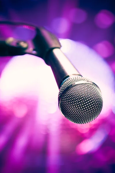 Microphone against purple bokeh background — Stock Photo © nikkytok ...