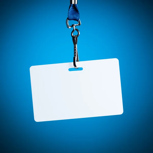 Empty white badge backdrop against blue background — Stock Photo ...