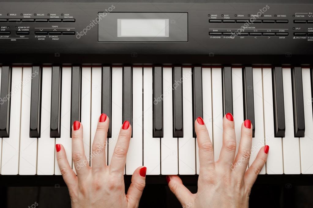 Hands playing digital piano synthesizer — Stock Photo © nikkytok #35825205