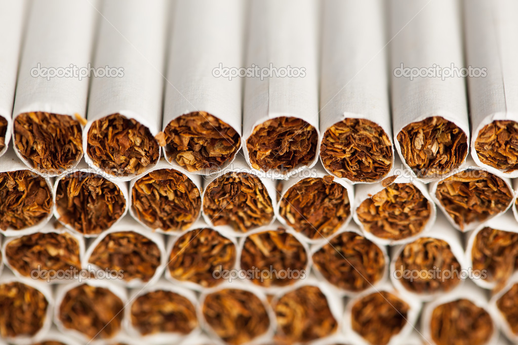 Cigarettes production line Stock Photo by ©nikkytok 38720757
