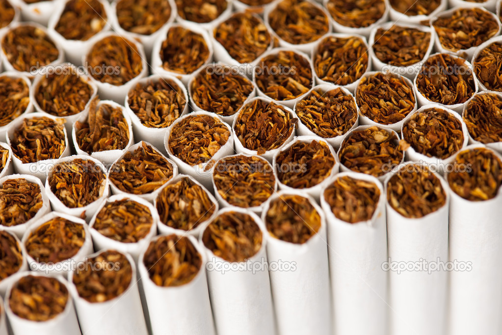 Cigarettes production line Stock Photo by ©nikkytok 39618525