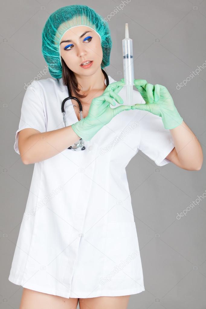 Young female doctor with syringe Stock Photo by ©ewastudio 32928055