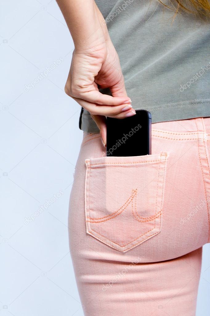 Black smartphone in back pocket of girl's jeans Stock Photo by ©nenetus ...