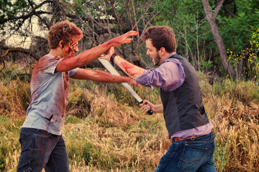 Man Battles a Zombie with A Machete — Stock Photo © KWPhotog #29949411