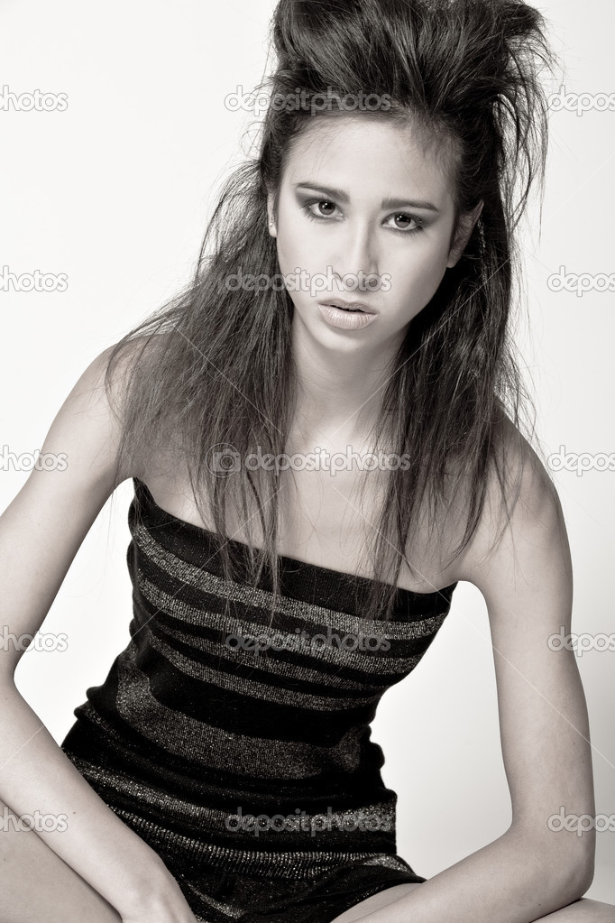 Mixed raced young beauty with high hair Stock Photo by ©dnf-style 12780336