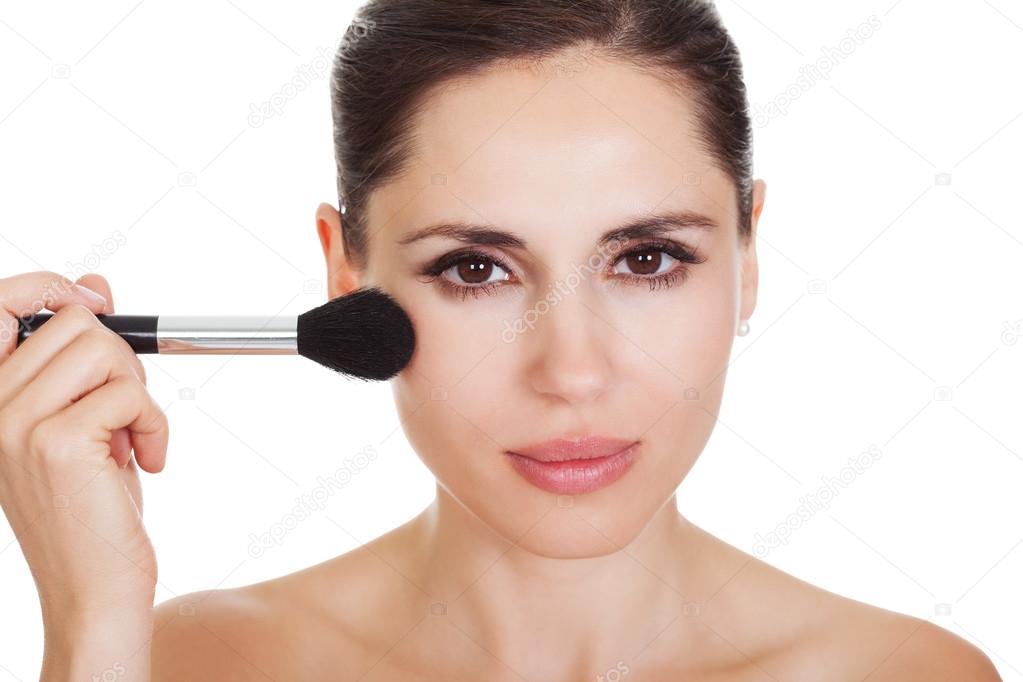 Beautiful woman applying blusher Stock Photo by ©AndreyPopov 12749992