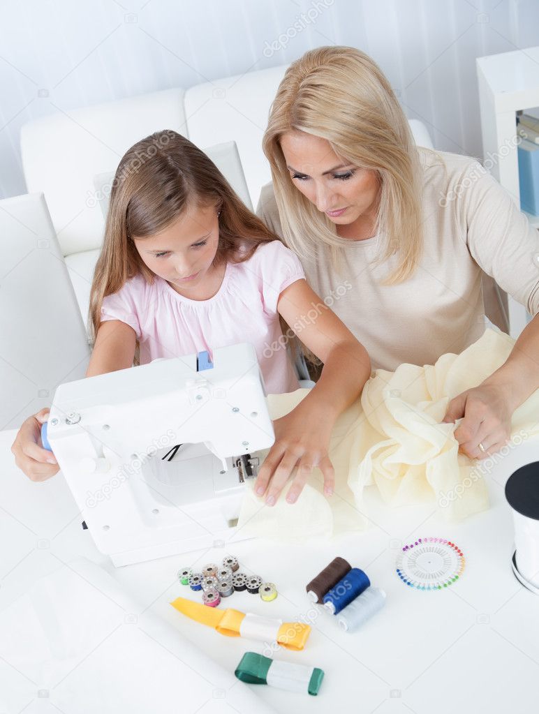 Beautiful Young Girl Sewing With Her Mother Stock Photo by ©AndreyPopov ...