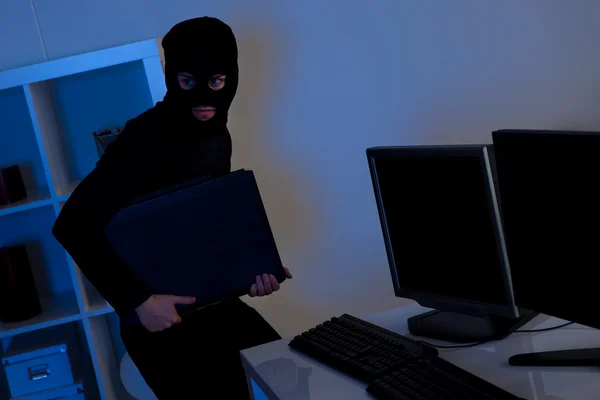 Thief Stealing Computer Stock Photo by ©AndreyPopov 104931662