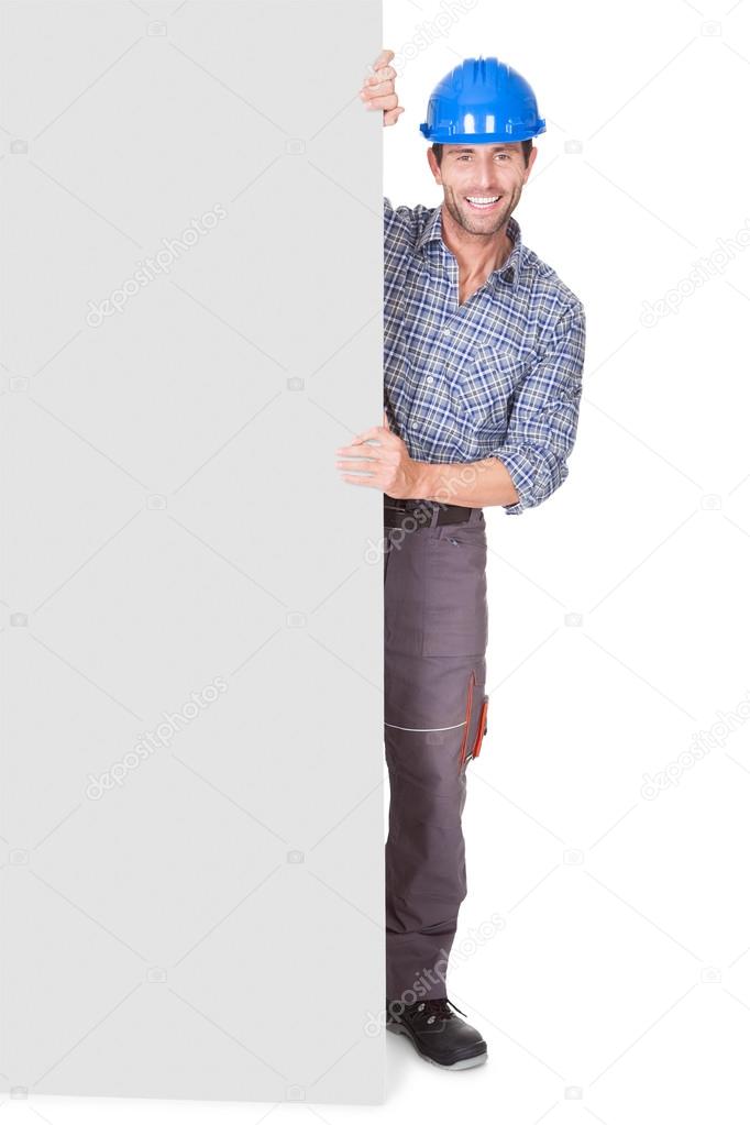 Portrait of happy worker presenting empty banner — Stock Photo © AndreyPopov #20213829