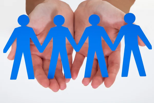 Male Hand Holding Human Figure Cutout Stock Photo by ©AndreyPopov 27663905