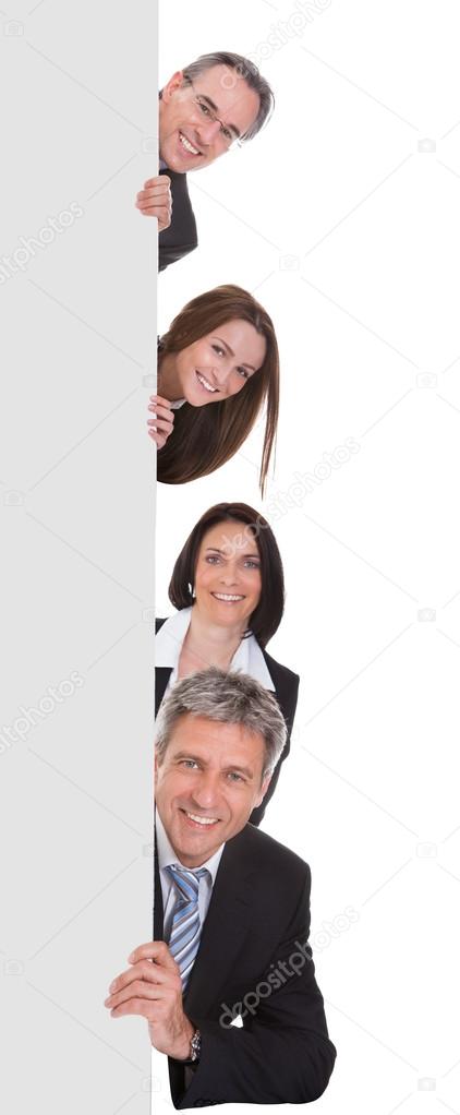 Business People Holding Placard — Stock Photo © AndreyPopov #28608493