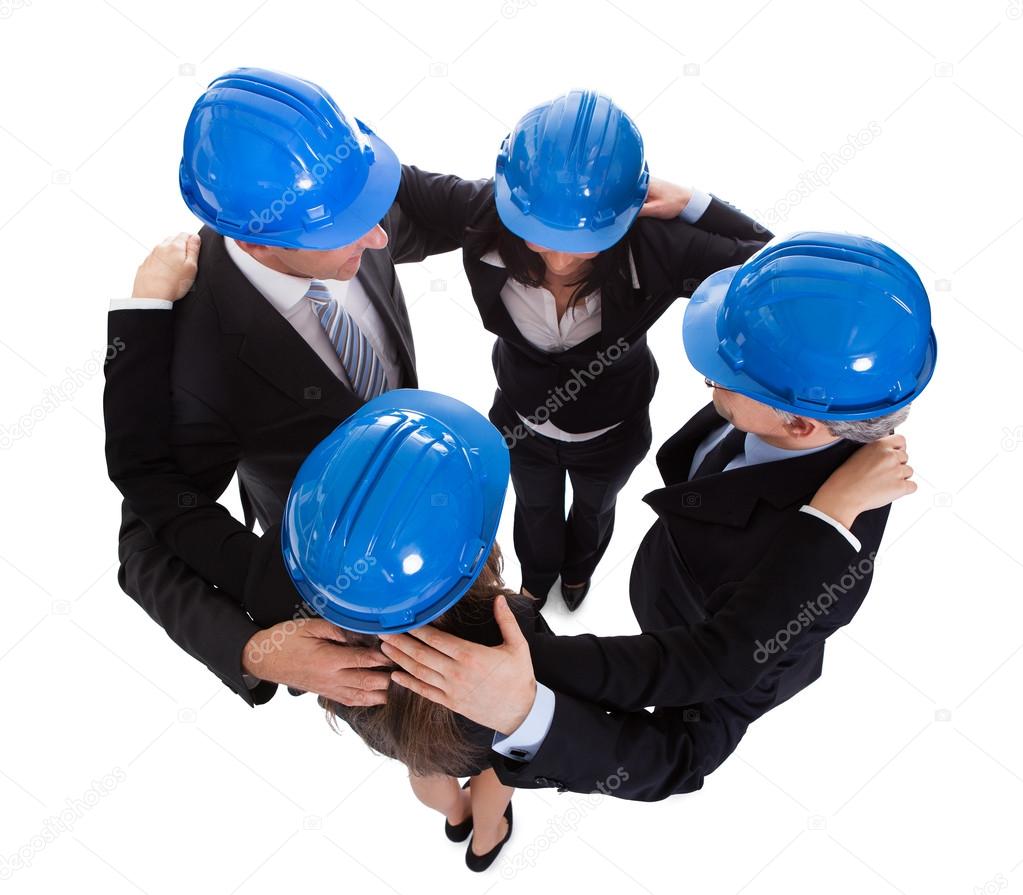 Happy Architects Making Huddle Stock Photo by ©AndreyPopov 28608951