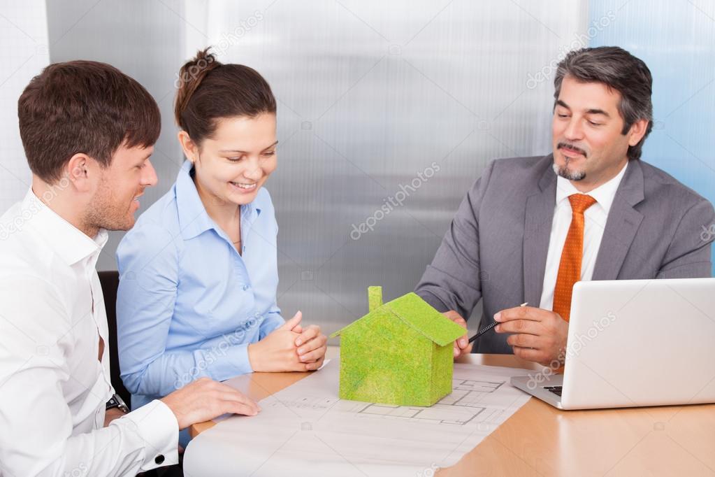 Couple And Consultant Discussing Together — Stock Photo © AndreyPopov ...