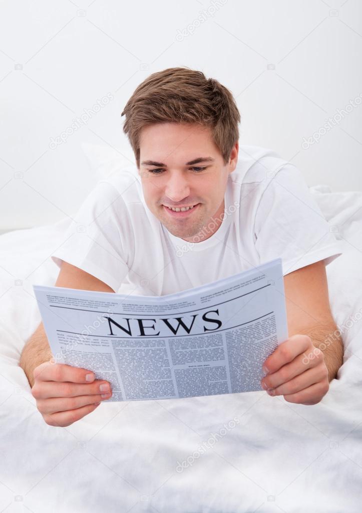 Man Reading Newspaper — Stock Photo © AndreyPopov #35620905