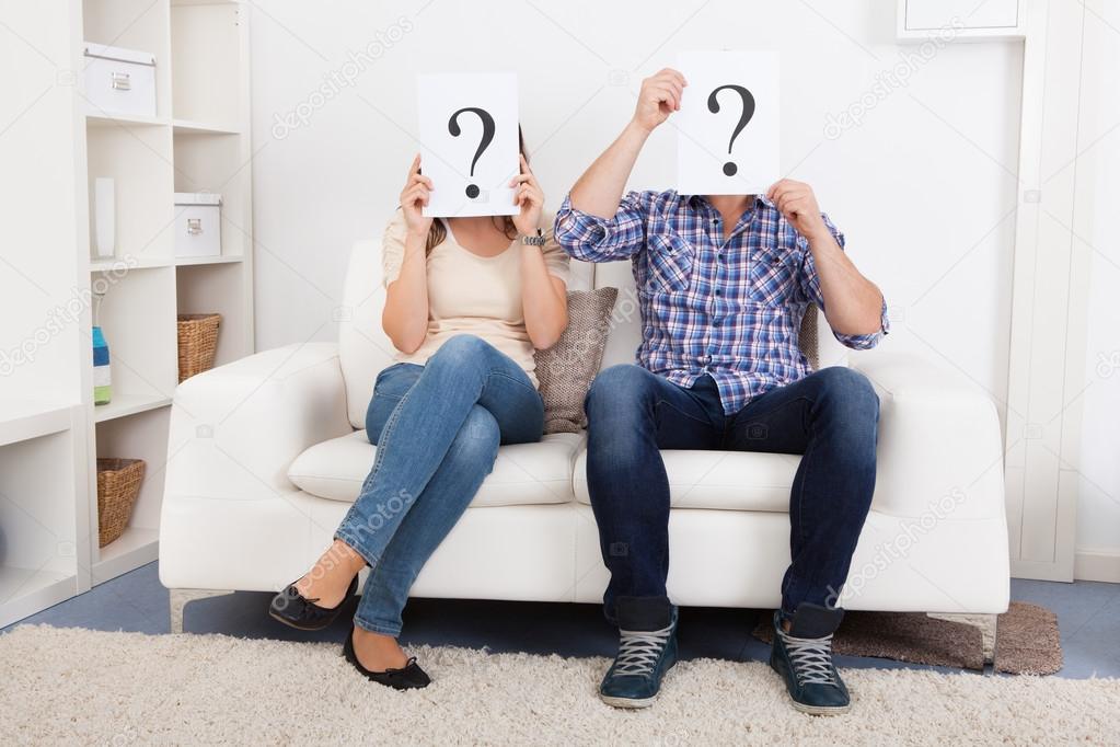 Couple Holding Question Mark Sign In Front Of Face — Stock Photo ...