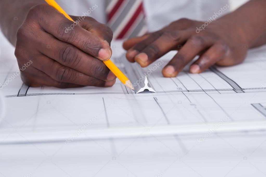 Person Drawing Blueprint Stock Photo by ©AndreyPopov 38713599