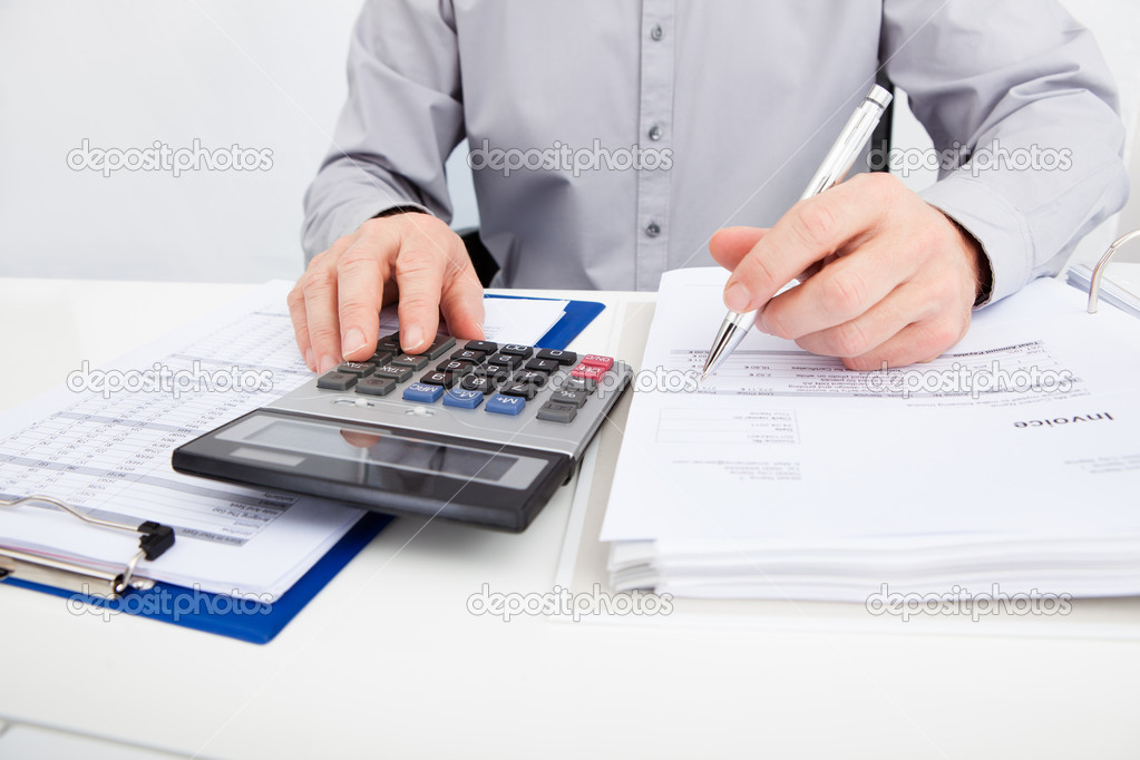 Man Calculating Bills Stock Photo by ©AndreyPopov 40086239
