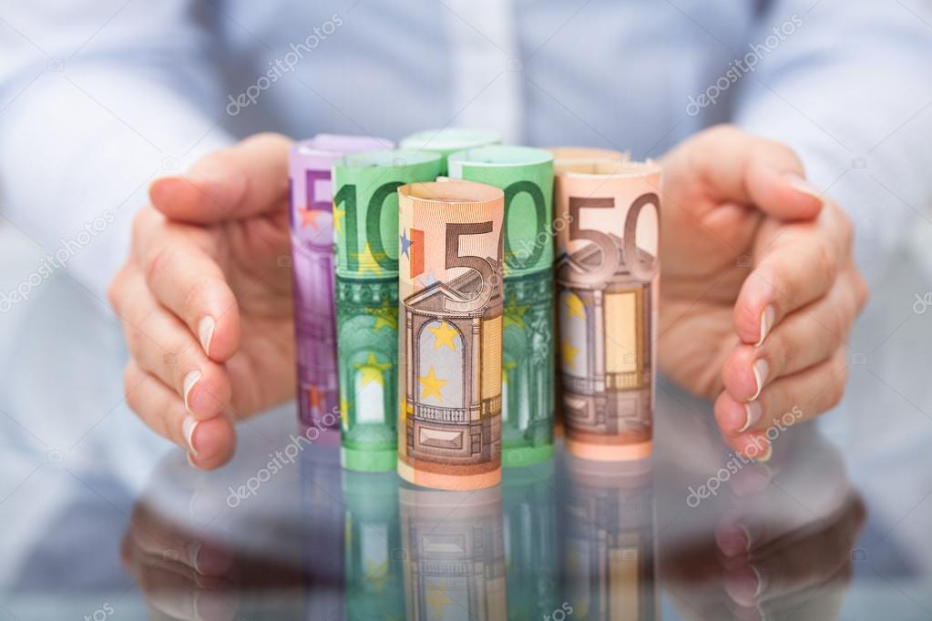 Hand Protecting Rolled Up Euro Banknote — Stock Photo © AndreyPopov ...